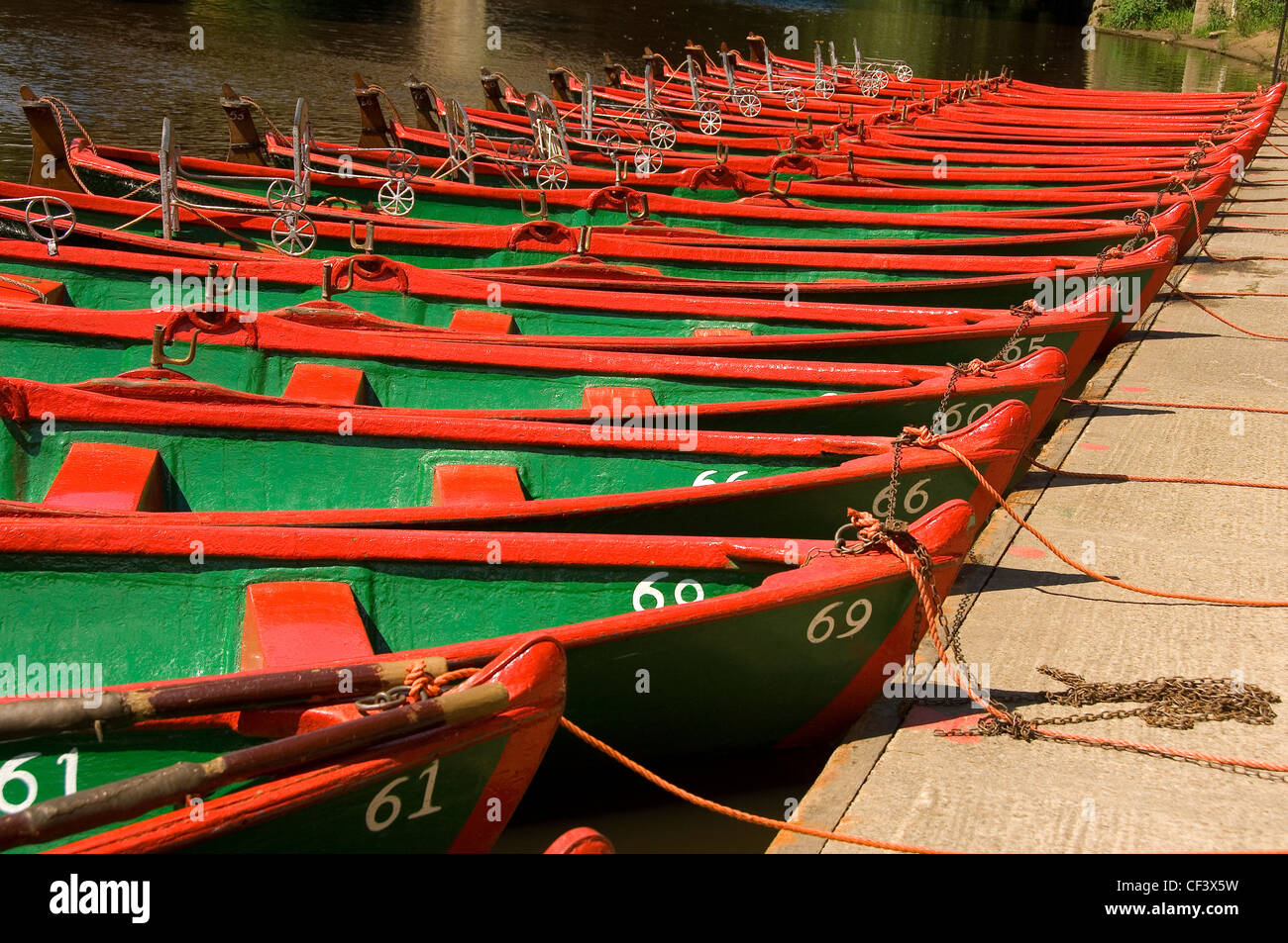 A line of moored wooden rowing boats for hire Stock Photo - Alamy