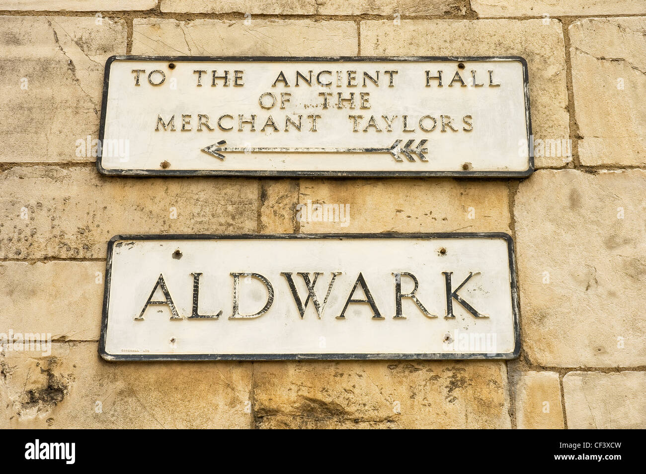 Street sign pointing to the Ancient Hall of the Merchant Taylors at ...