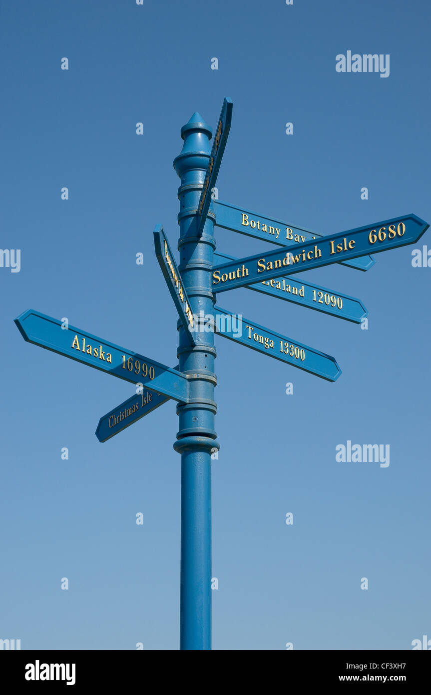 A signpost showing distances and directions from Whitby of Captain Cook ...