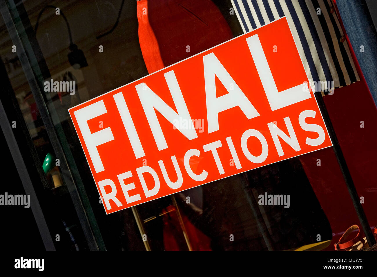 Final reductions sign in a shop window Stock Photo - Alamy