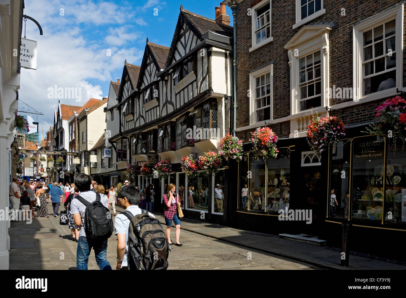 Visitors in Stonegate, an old street in York built on the Roman road ...