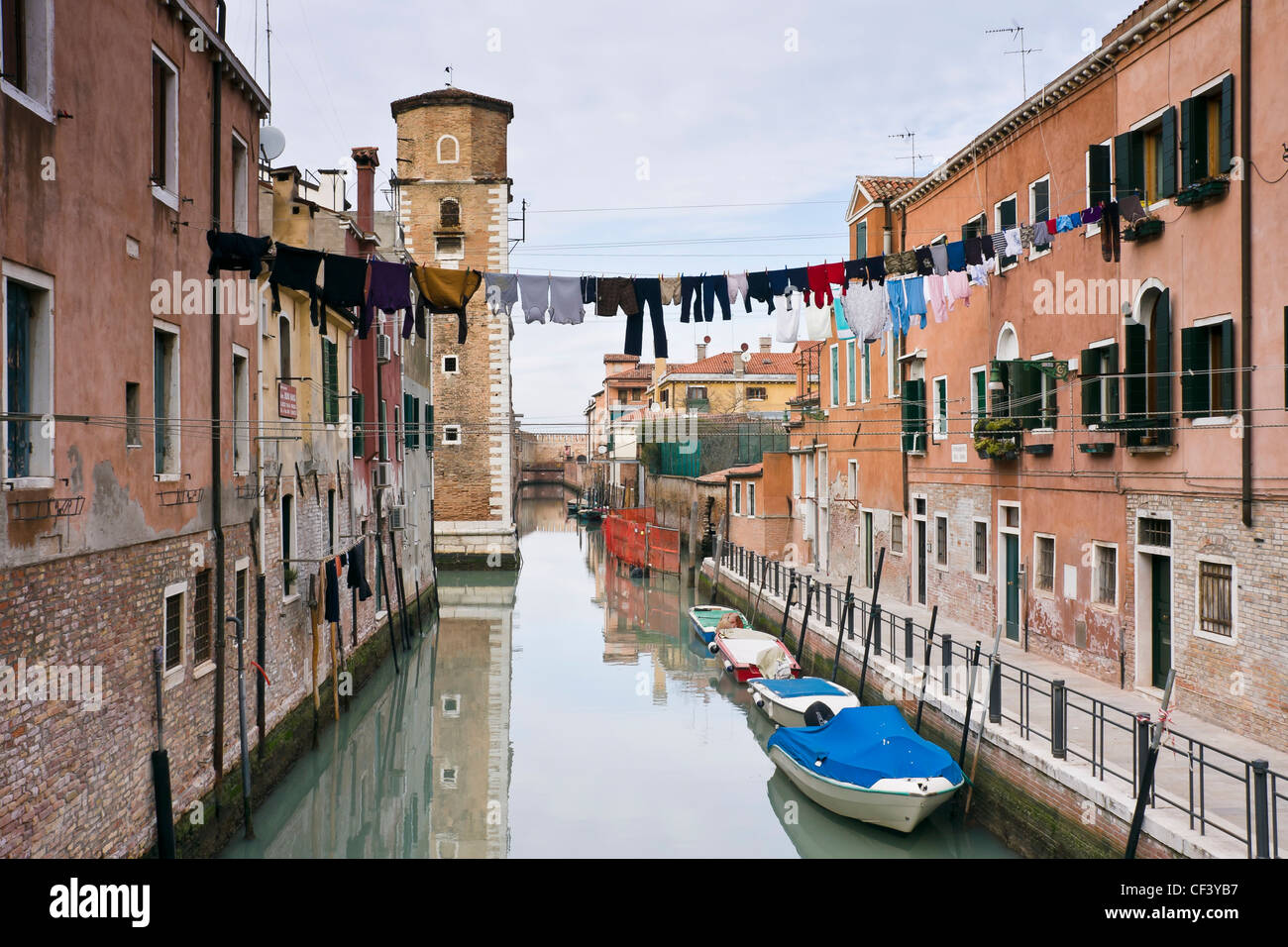 Laundry drying on clothesline between two buildings in Castello ...