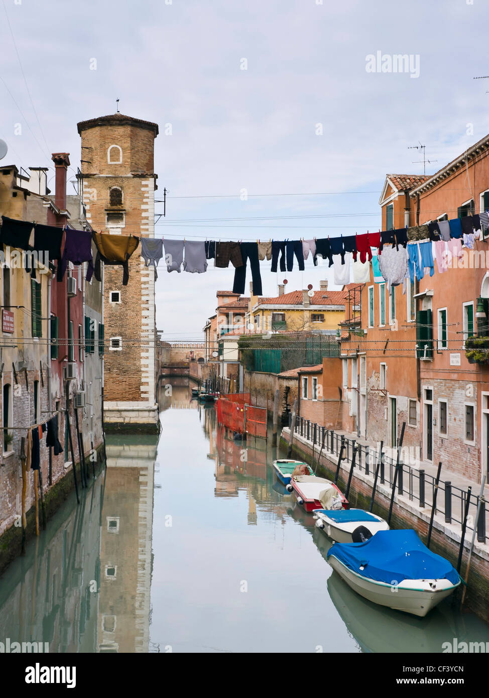 Laundry drying on clothesline between two buildings in Castello ...