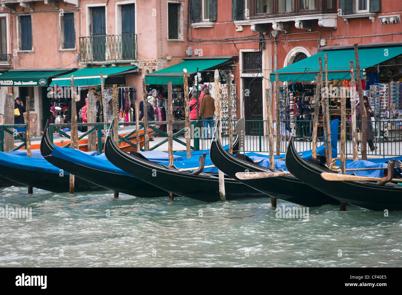 Gondolas moored at Riva del Carbon on the Grand Canal - Venice, Venezia ...