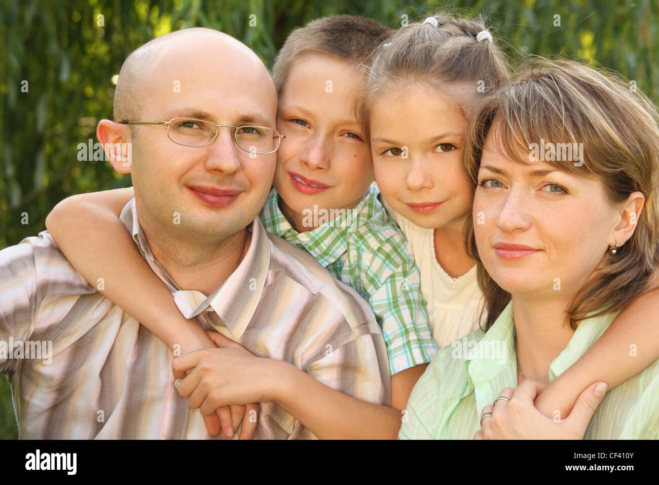 family with two children near osier looking at camera Stock Photo - Alamy