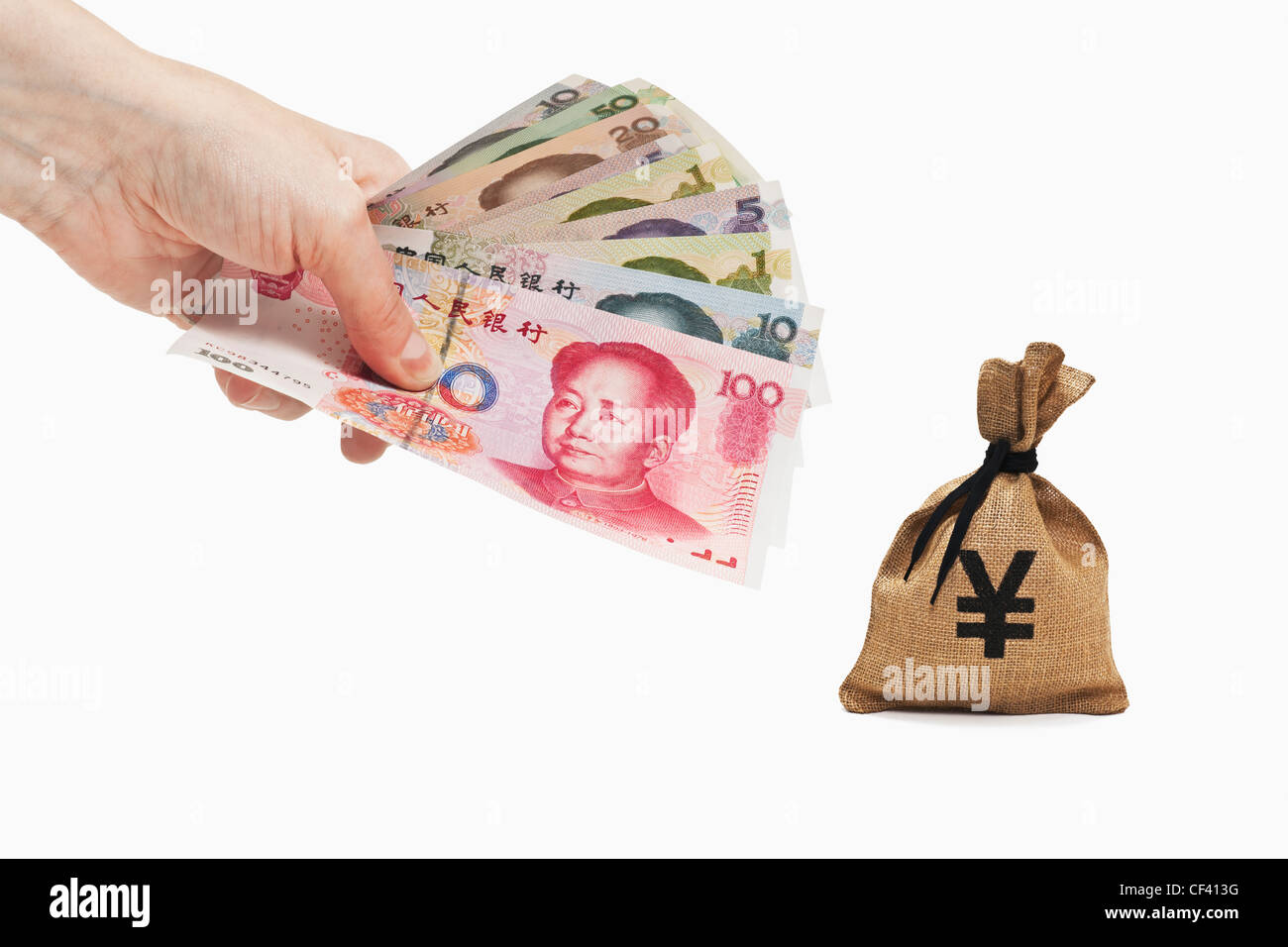 Many diverse Chinese Yuan bills with the portrait of Mao Zedong are ...