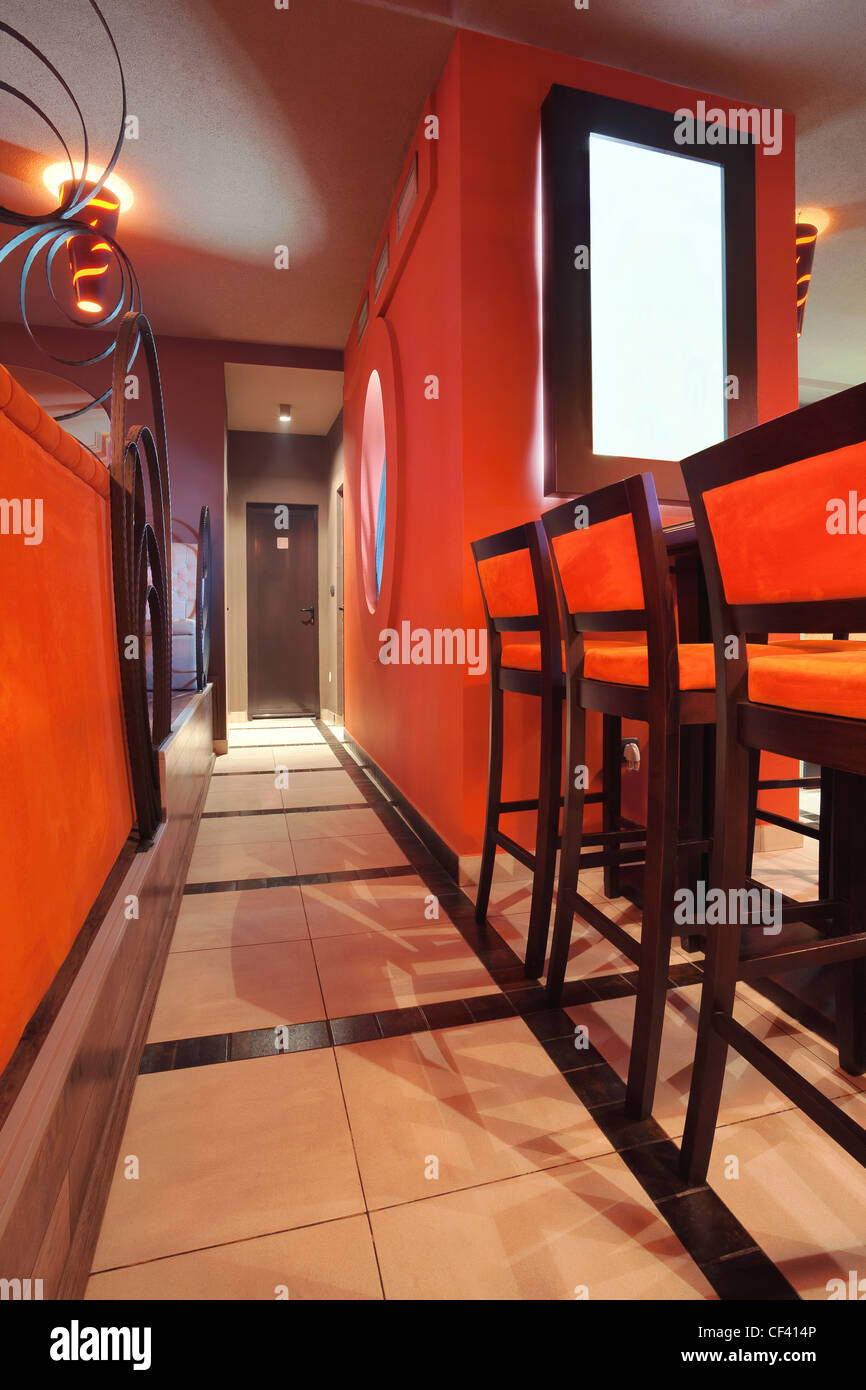 Interior of a restaurant, modern design in few colors, orange and brown ...