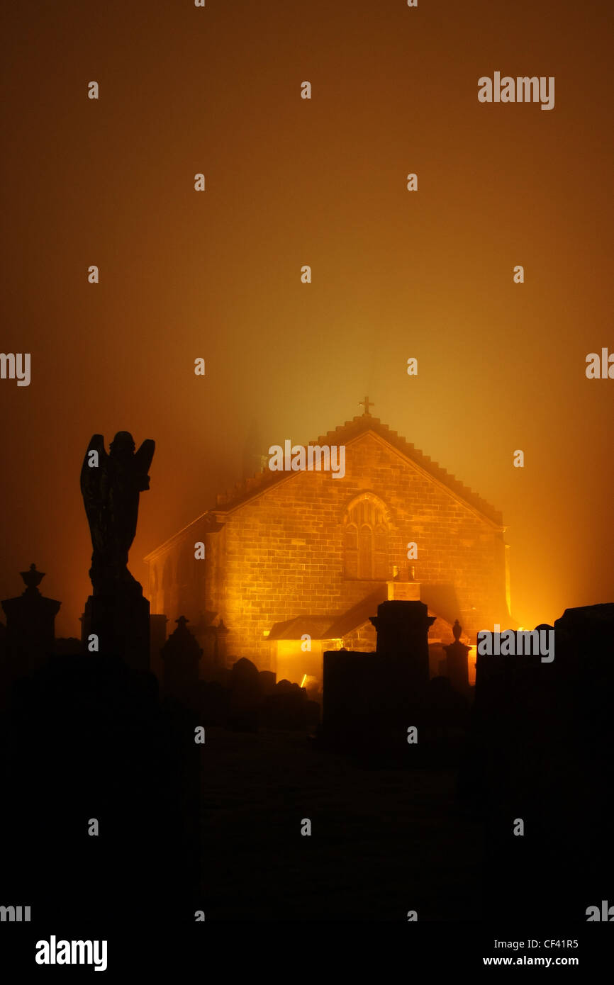 Church in night fog with statue Stock Photo - Alamy