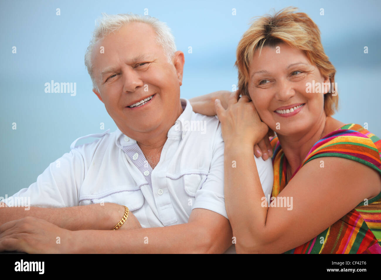 Smiling elderly married couple on veranda near seacoast Stock Photo - Alamy