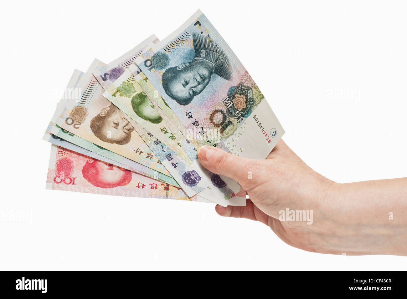 Many diverse Chinese Yuan bills with the portrait of Mao Zedong are ...
