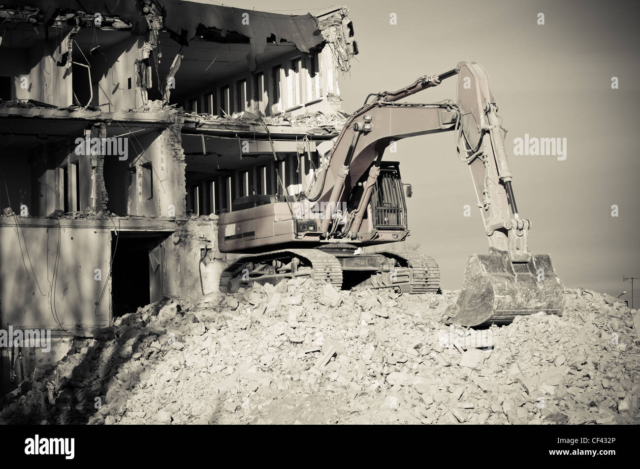 digger working during the demolition of the building Stock Photo - Alamy