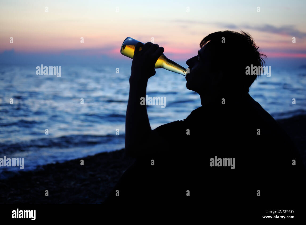 Boy drinking beer silhouette hi-res stock photography and images - Alamy
