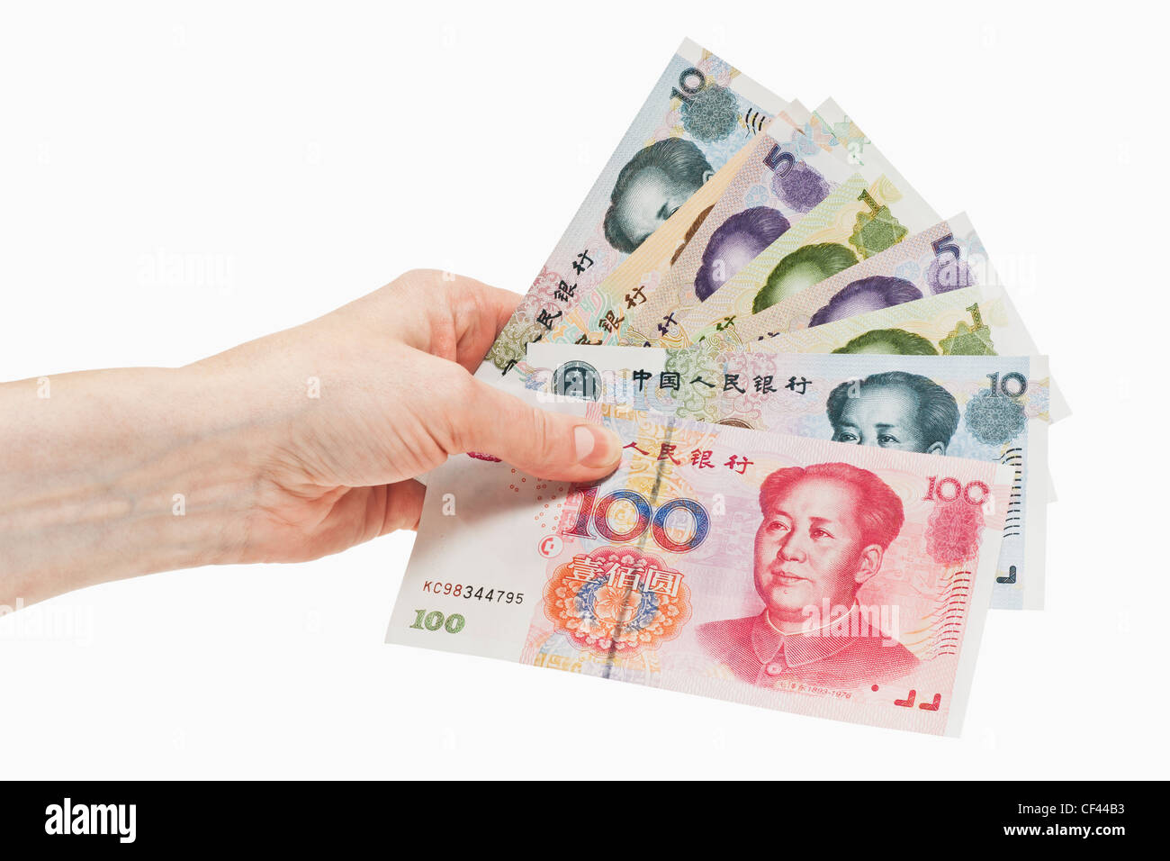 Many diverse Chinese Yuan bills with the portrait of Mao Zedong are ...