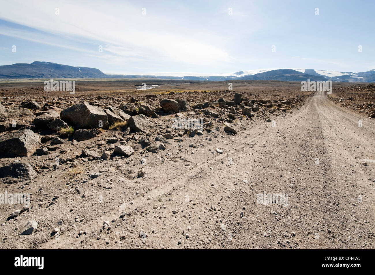 Desert road through the barren, deserted tundra landscape of Central ...
