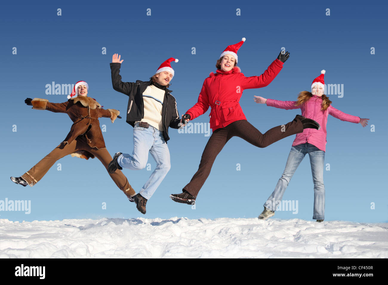 Many jumping people on snow Stock Photo - Alamy