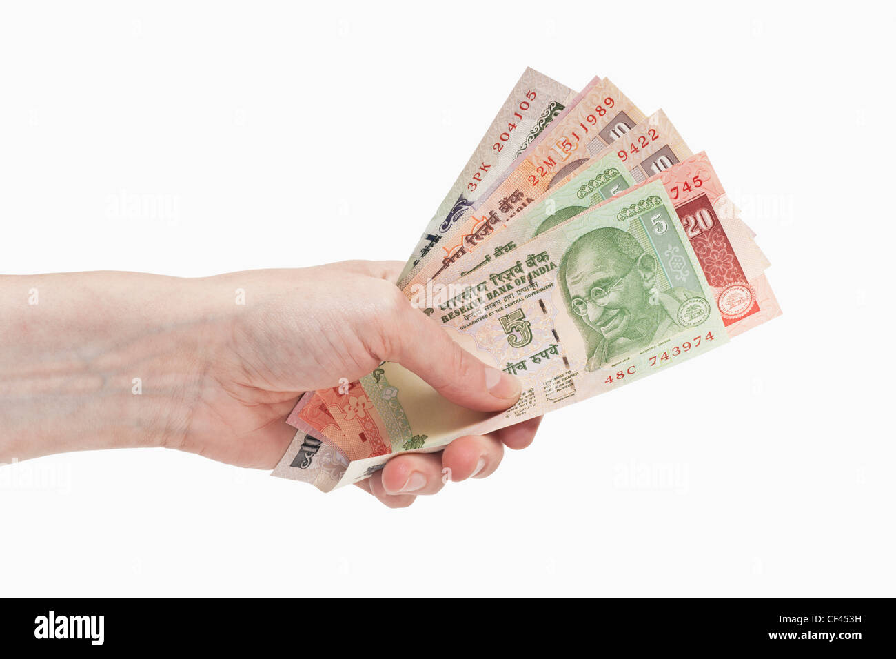 Many diverse Indian rupee bills with the portrait of Mahatma Gandhi are ...