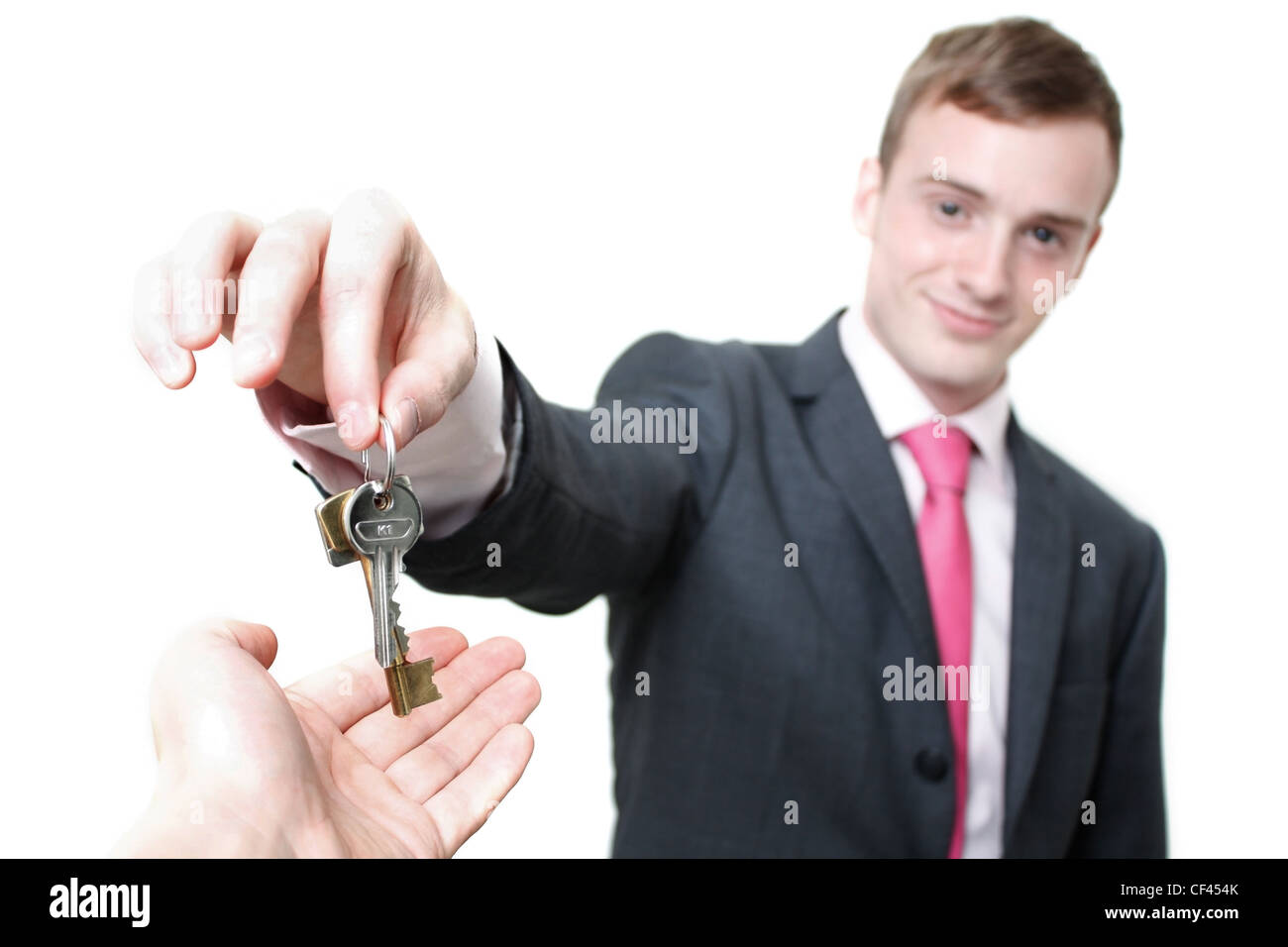 A business man giving you the keys to a home Stock Photo - Alamy