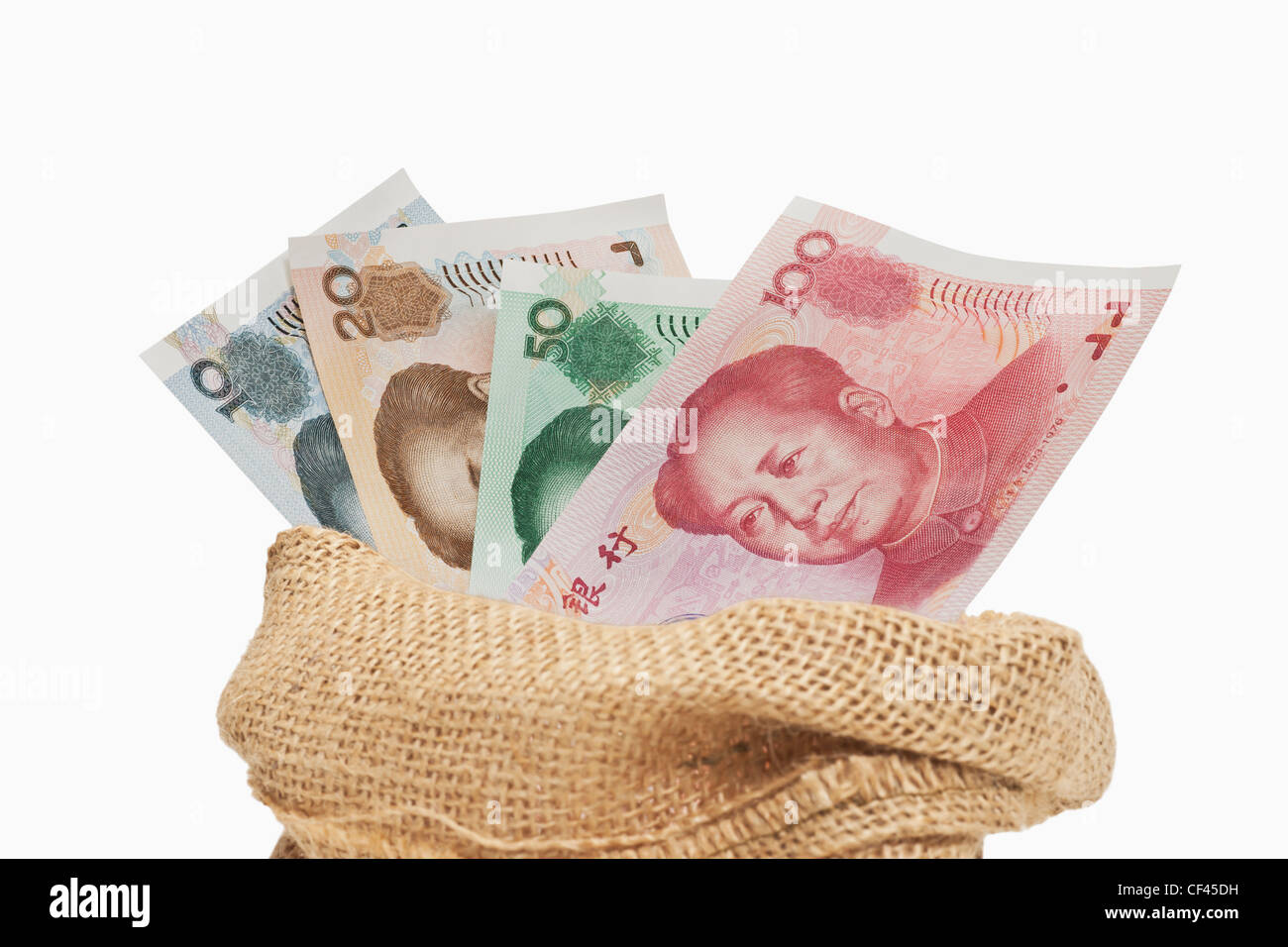 Many diverse Chinese Yuan bills with the portrait of Mao Zedong are in ...
