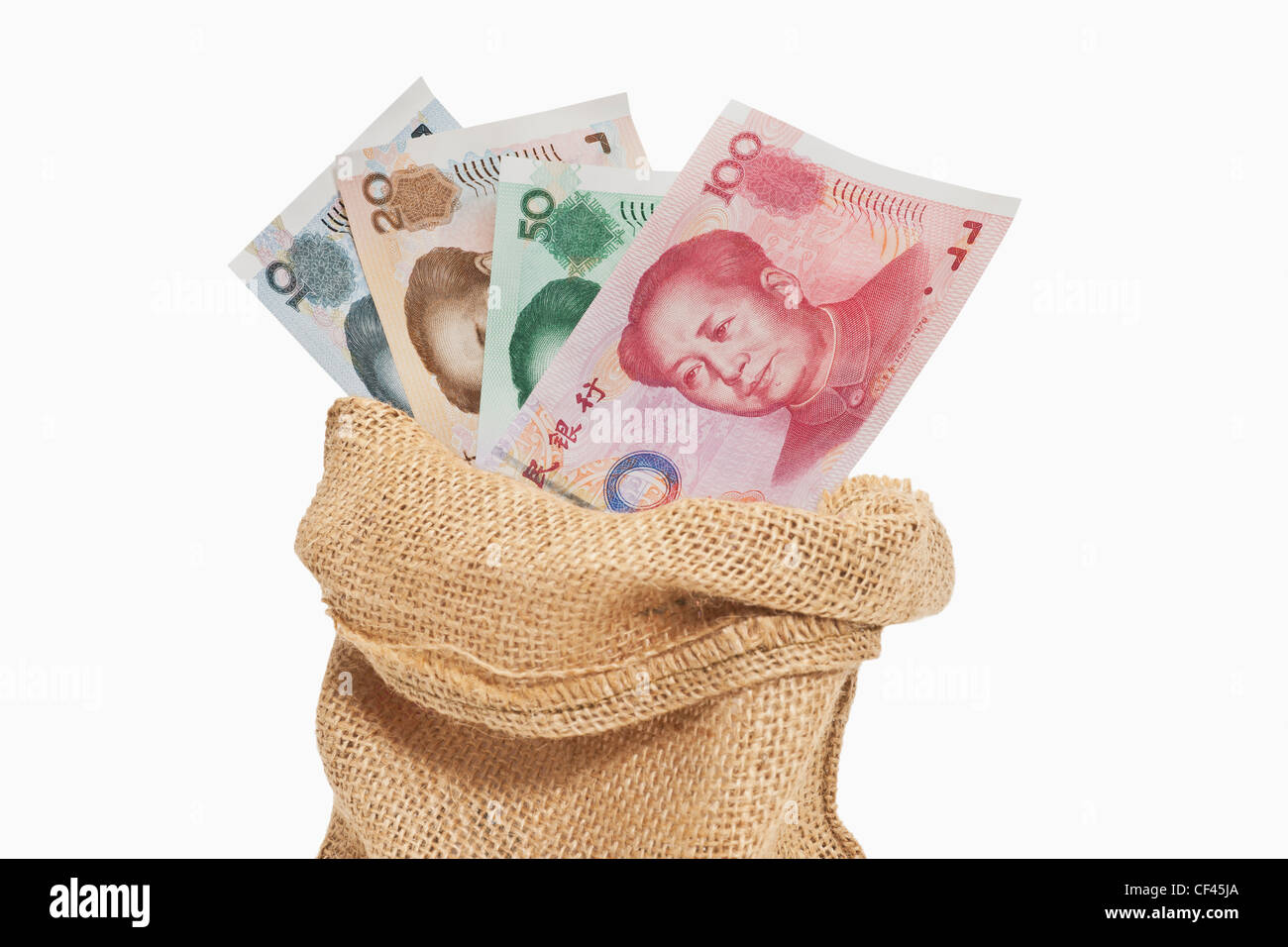 Many diverse Chinese Yuan bills with the portrait of Mao Zedong are in ...