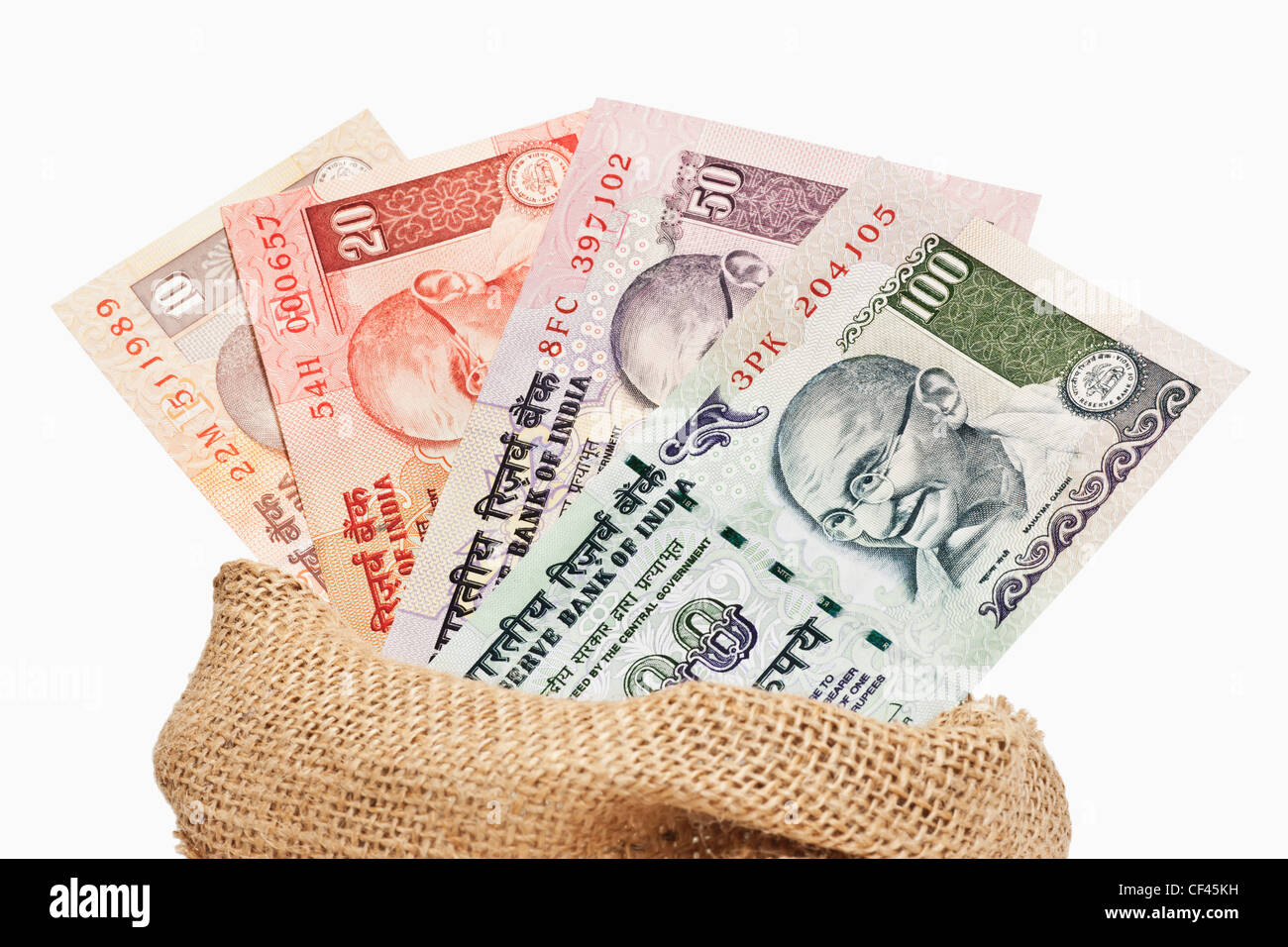 Many diverse Indian rupee bills with the portrait of Mahatma Gandhi are ...