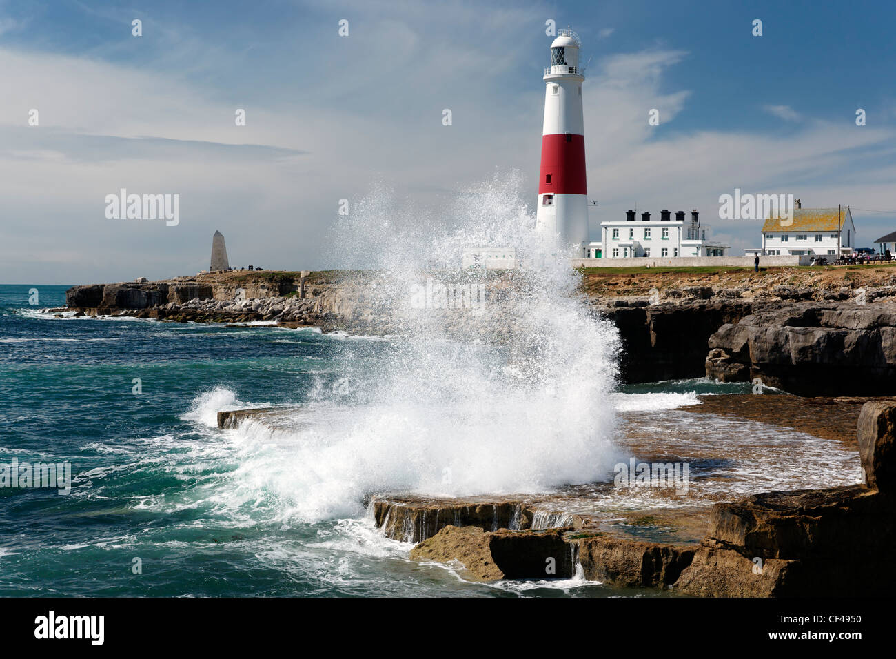 Lighthouse breaking waves hi-res stock photography and images - Alamy