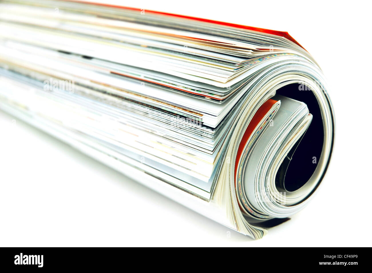 Magazines rolled up on an isolated background Stock Photo - Alamy