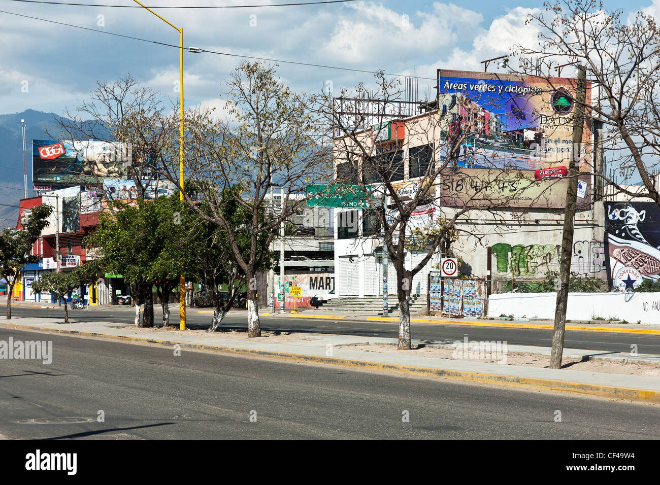 boulevard commercial strip in Oaxaca Mexico with colorful advertising ...