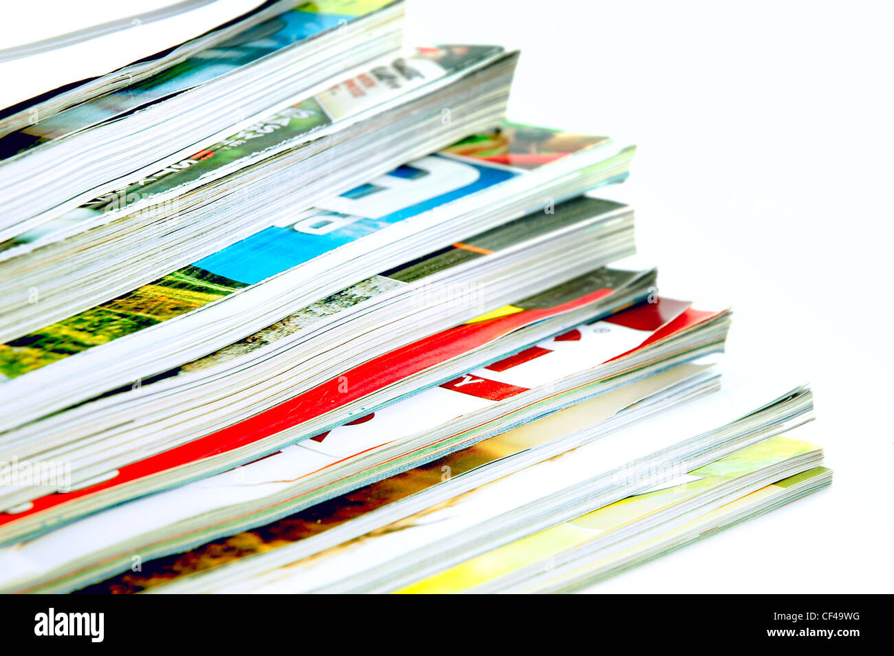 Stack of magazines on an isolated background Stock Photo - Alamy