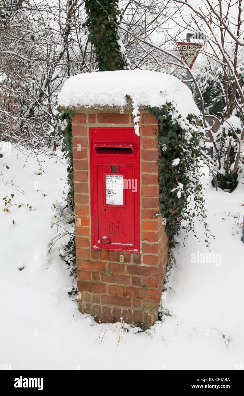 Post Box covered in snow Stock Photo - Alamy