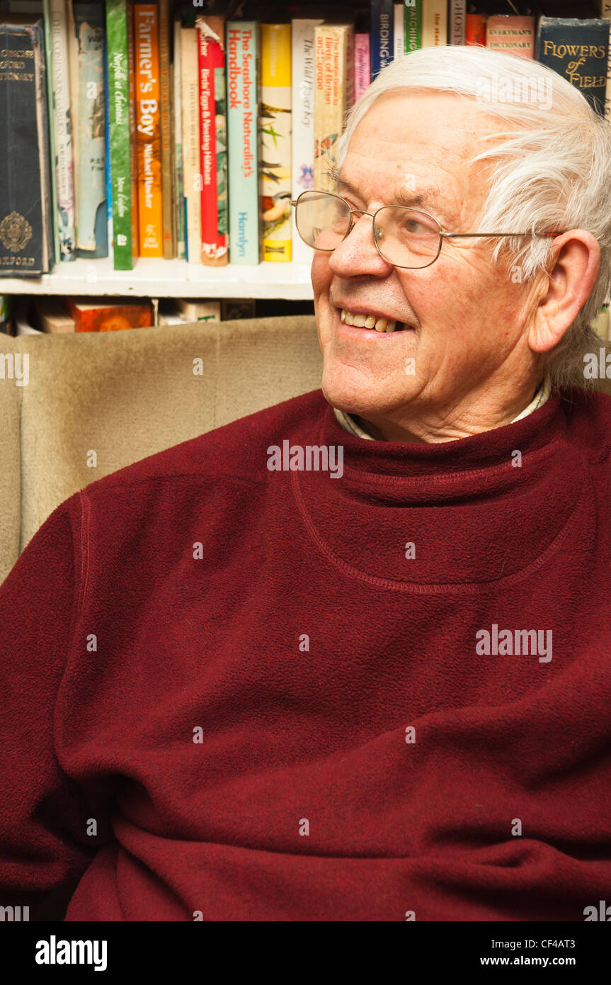 A senior elderly man in his 80's relaxing at home in England , Britain ...