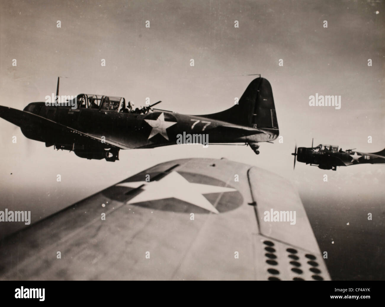 Leading the flight of the Bulldog dive bombers, the Major is shown ...