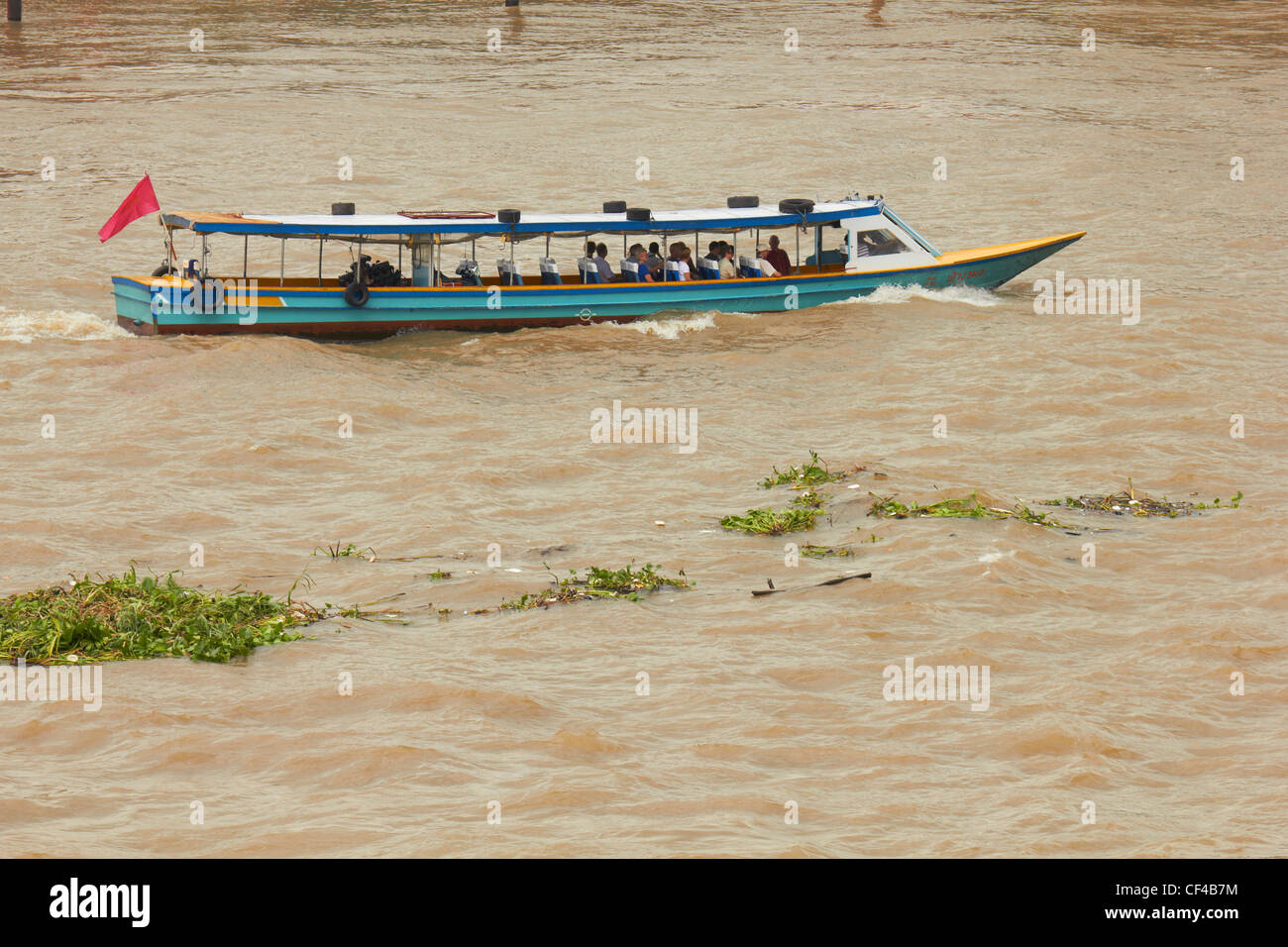 Thailand flood - Big long Boat with people float down river - Bangkok ...