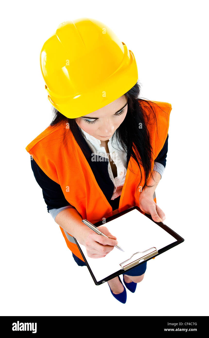 Woman engineer taking notes in clipboard - elevated view Stock Photo ...