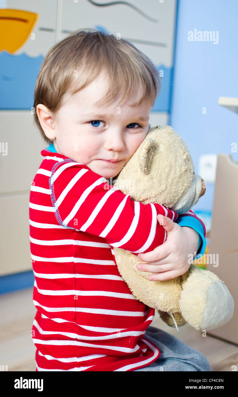 Sweet child with teddy bear Stock Photo - Alamy