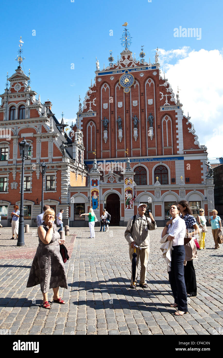 People on a tour of Riga outside St Peters church Stock Photo - Alamy