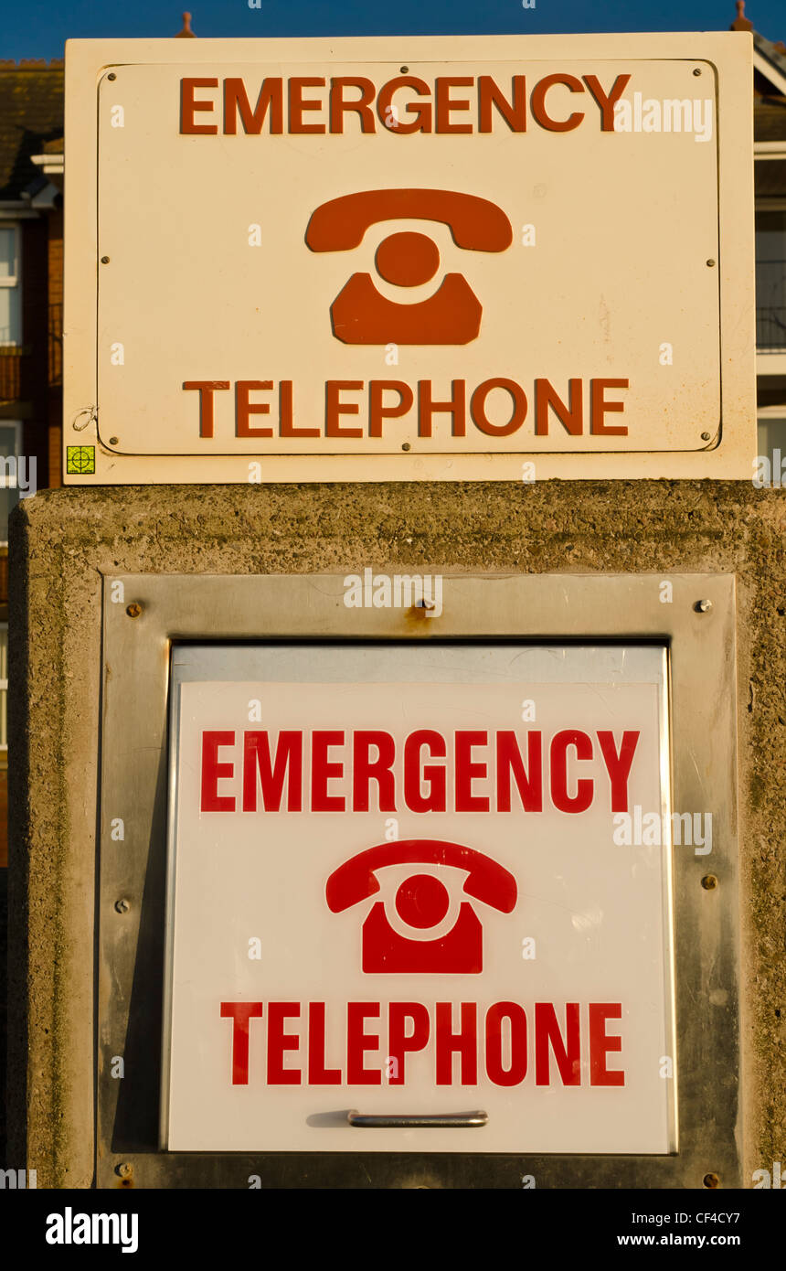 Emergency telephone sign at the coast Stock Photo - Alamy