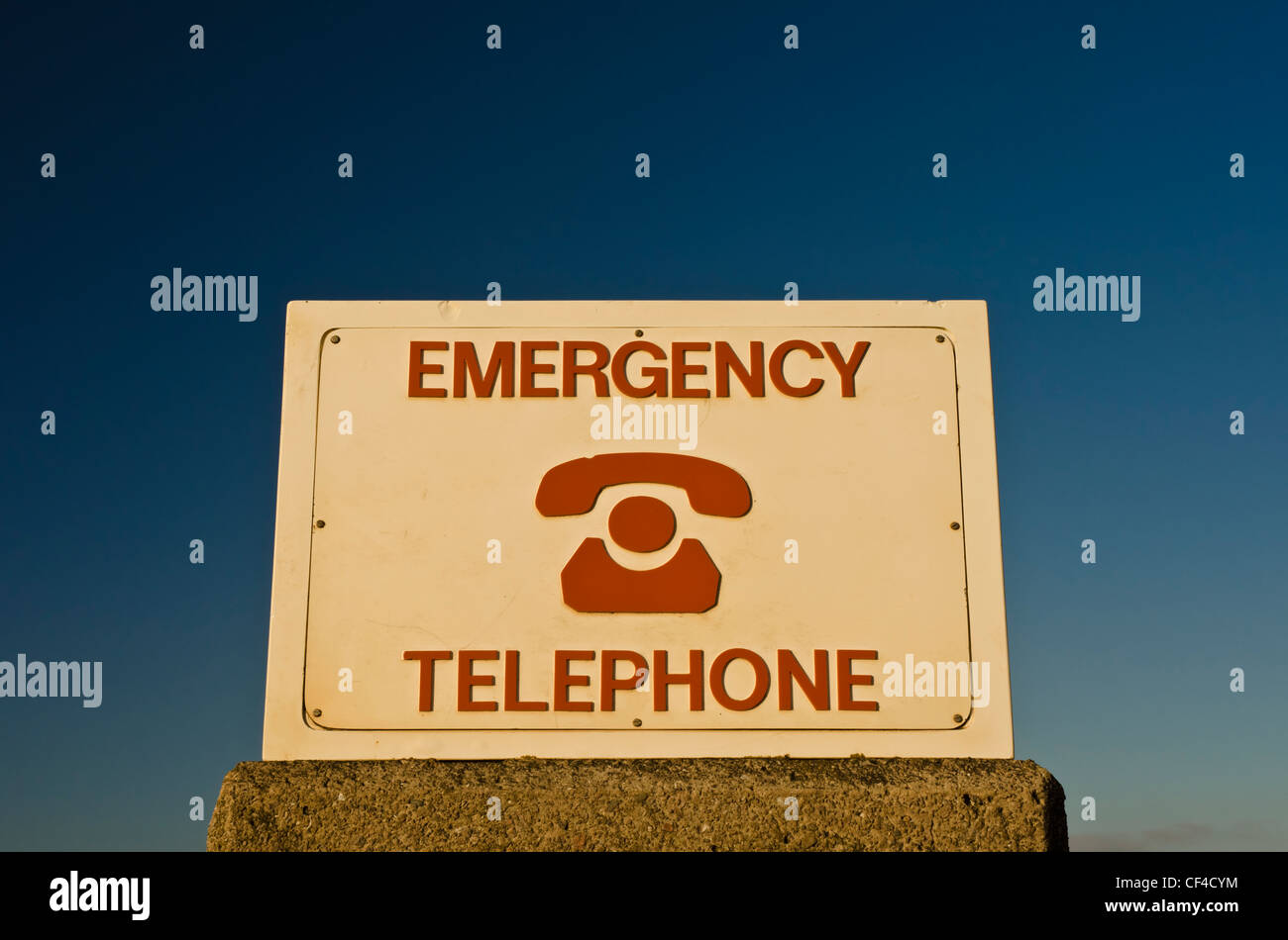 Emergency telephone sign at the coast Stock Photo - Alamy