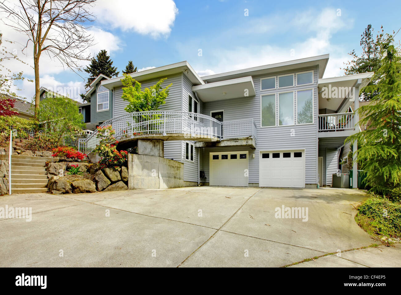 Large grey house exterior of modern home with large parking lot Stock ...