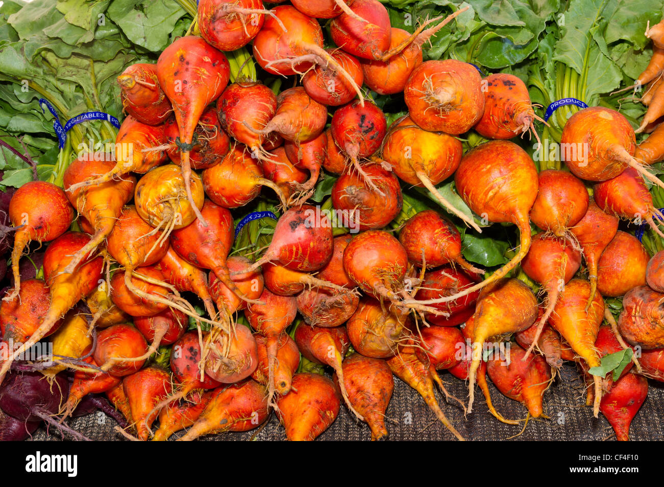 Fresh orange beets on display at the farmer's market Stock Photo - Alamy