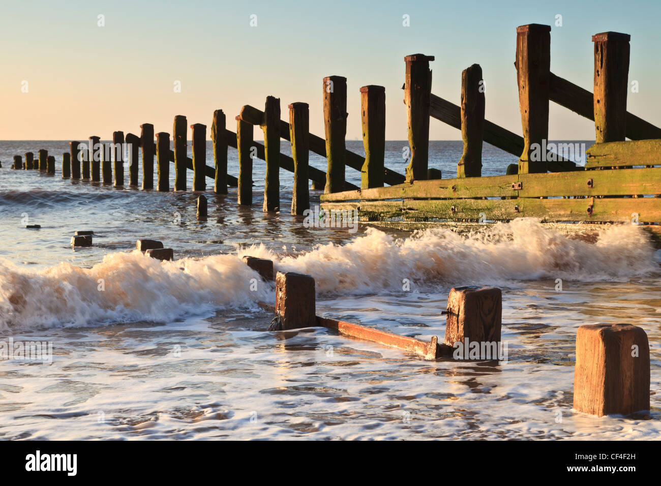 Worn posts placed in the sand at Spurn Point in an attempt to defend ...