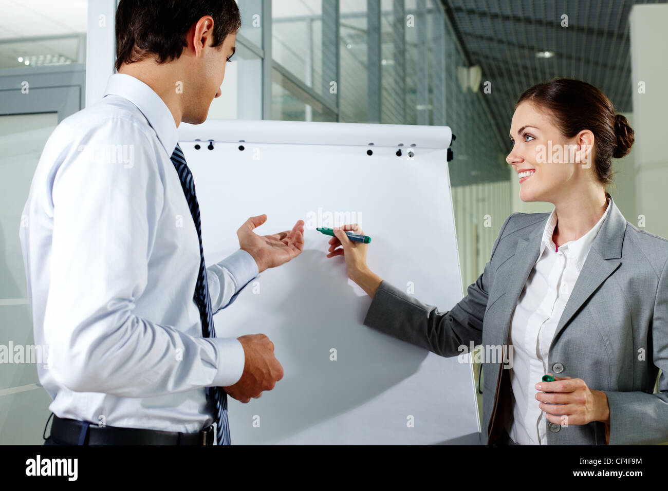 Two business colleagues working on project together Stock Photo - Alamy