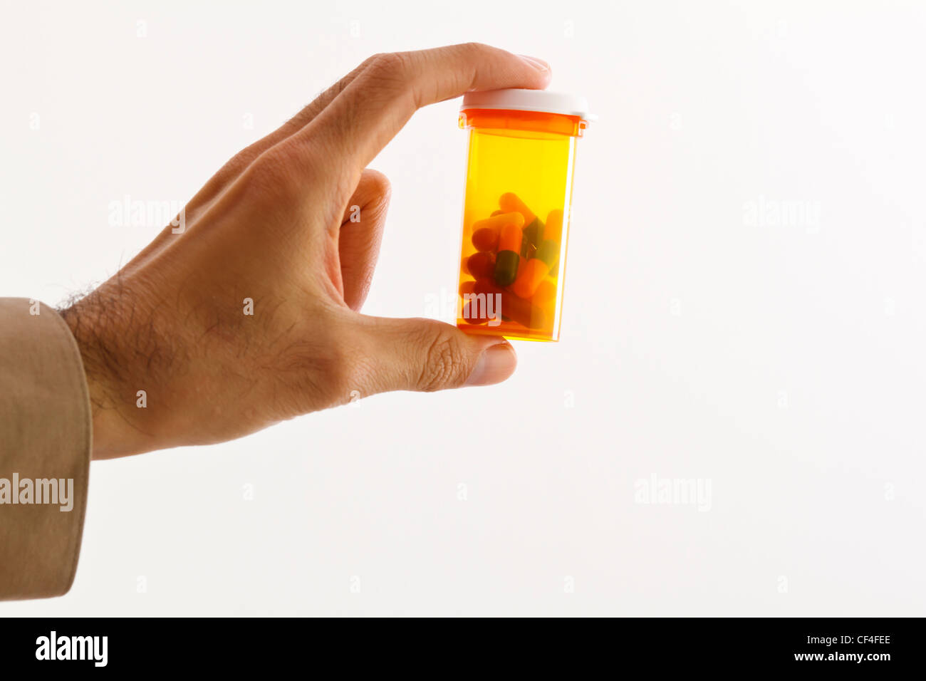 hand holding a vial with medication in it Stock Photo - Alamy