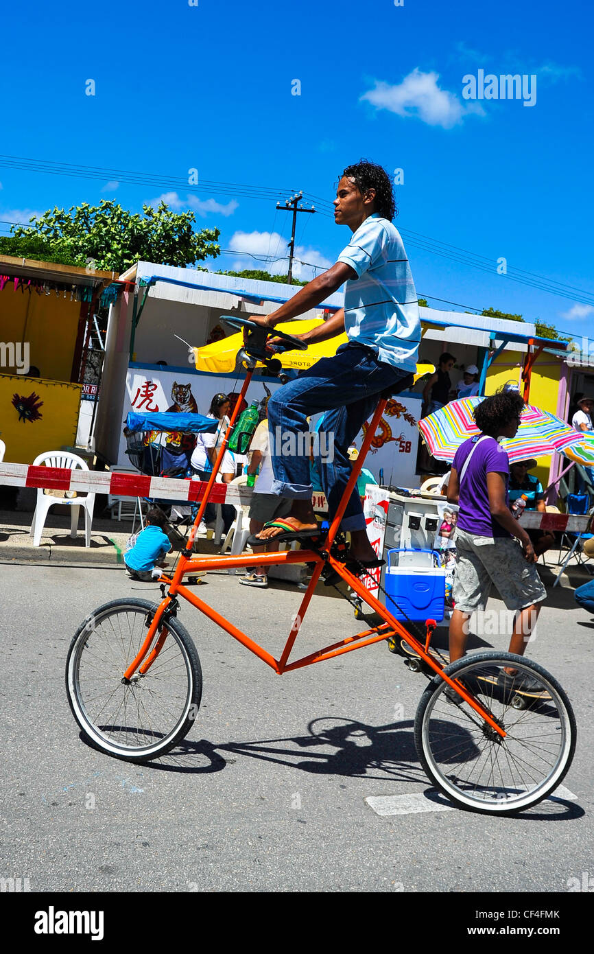 Boy on self made bike during Carnival festival Aruba Stock Photo - Alamy