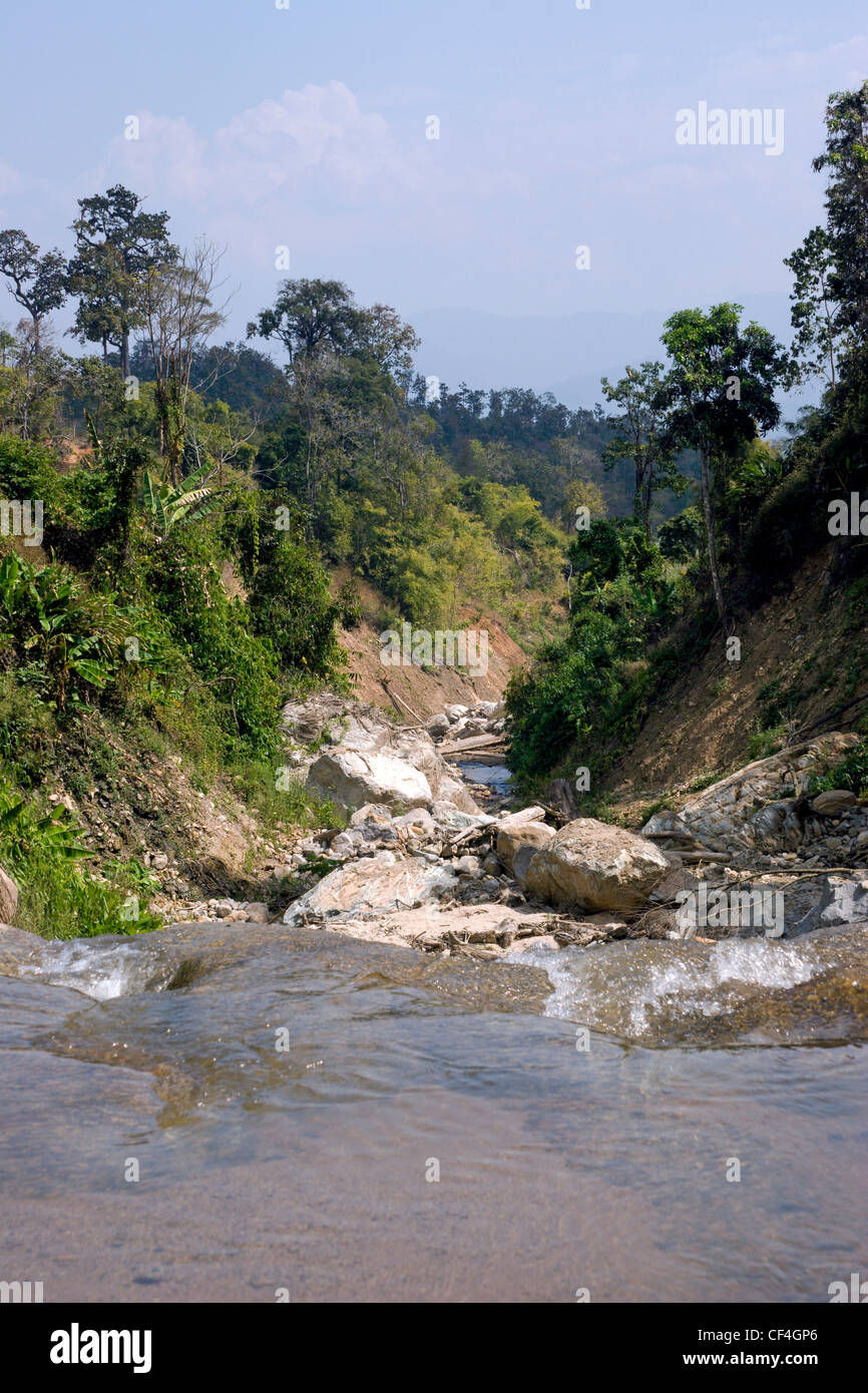 A deep gorge and flowing waterfalls with pools offer a scenic view at a ...