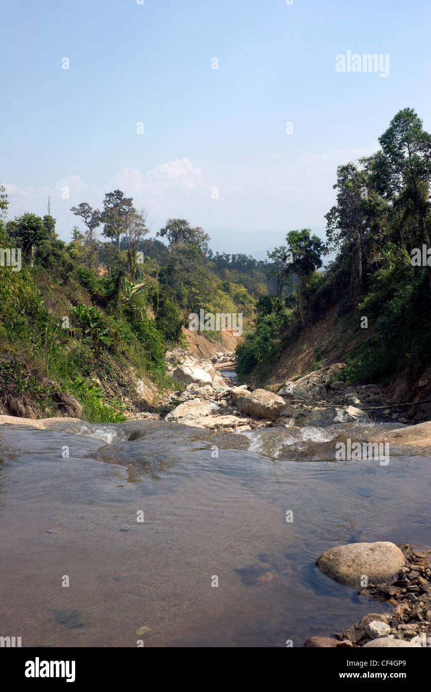 A deep gorge and flowing waterfalls with pools offer a scenic view at a ...