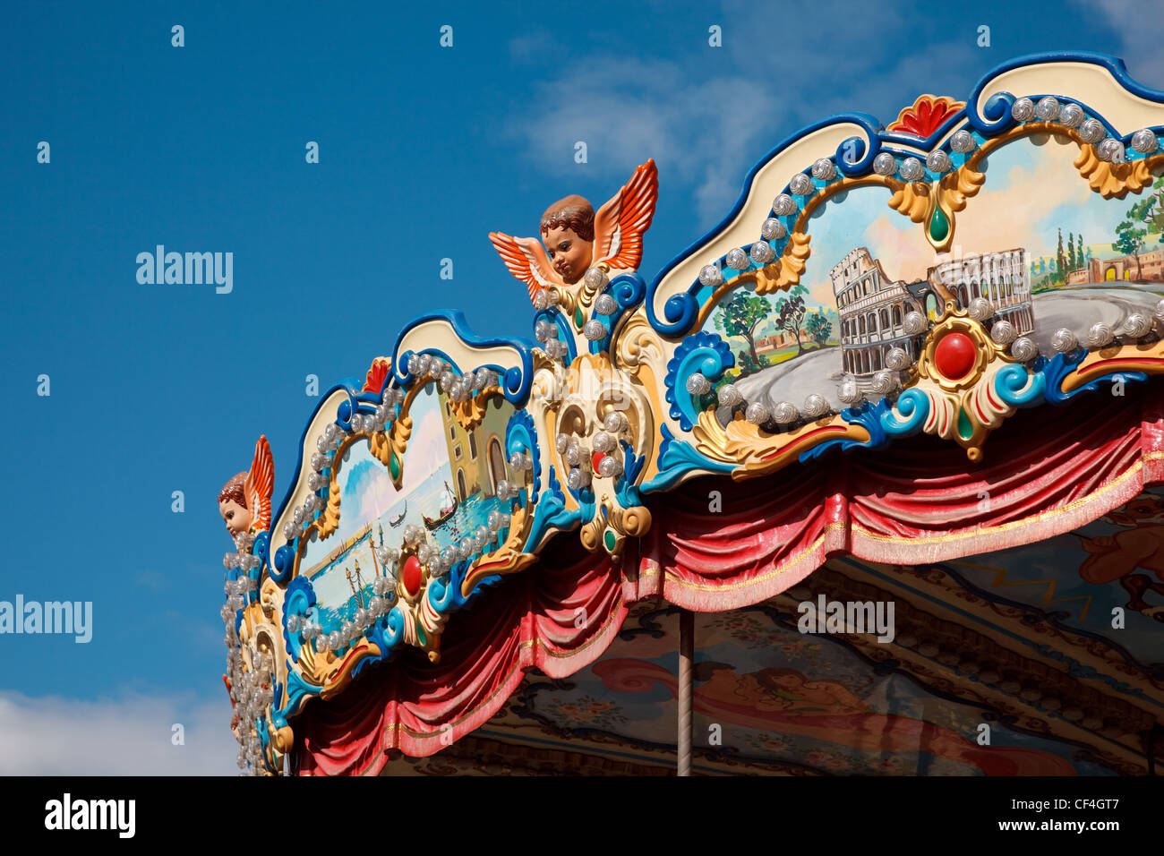Amusement park - piece of roof of carousel, richly decorated with ...