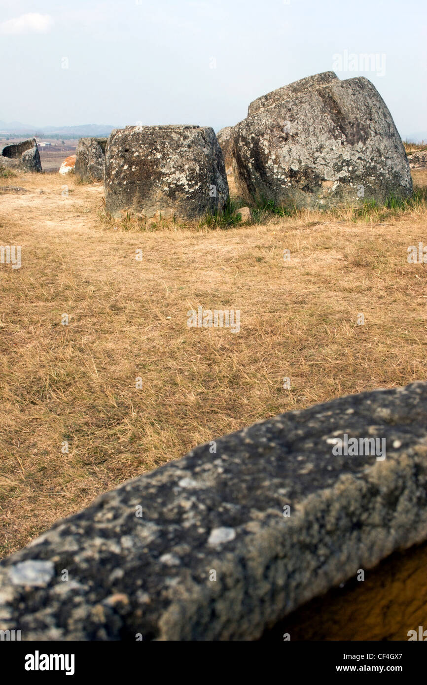Stone jars in a field are on display at Plain of Jars Archeological ...