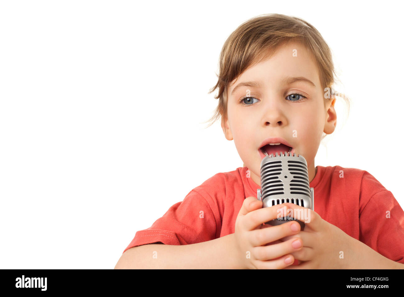 pretty little girl in red sing in old style microphone isolated on ...