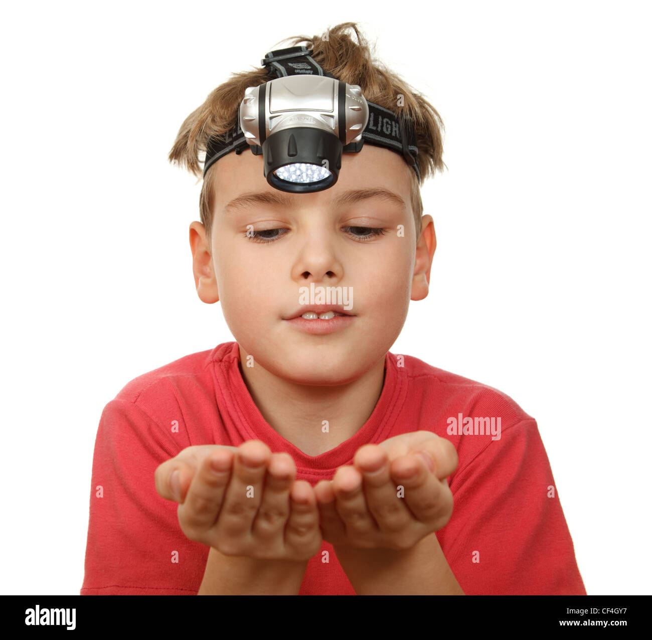Portrait of boy with flashlight on his head on white background ...