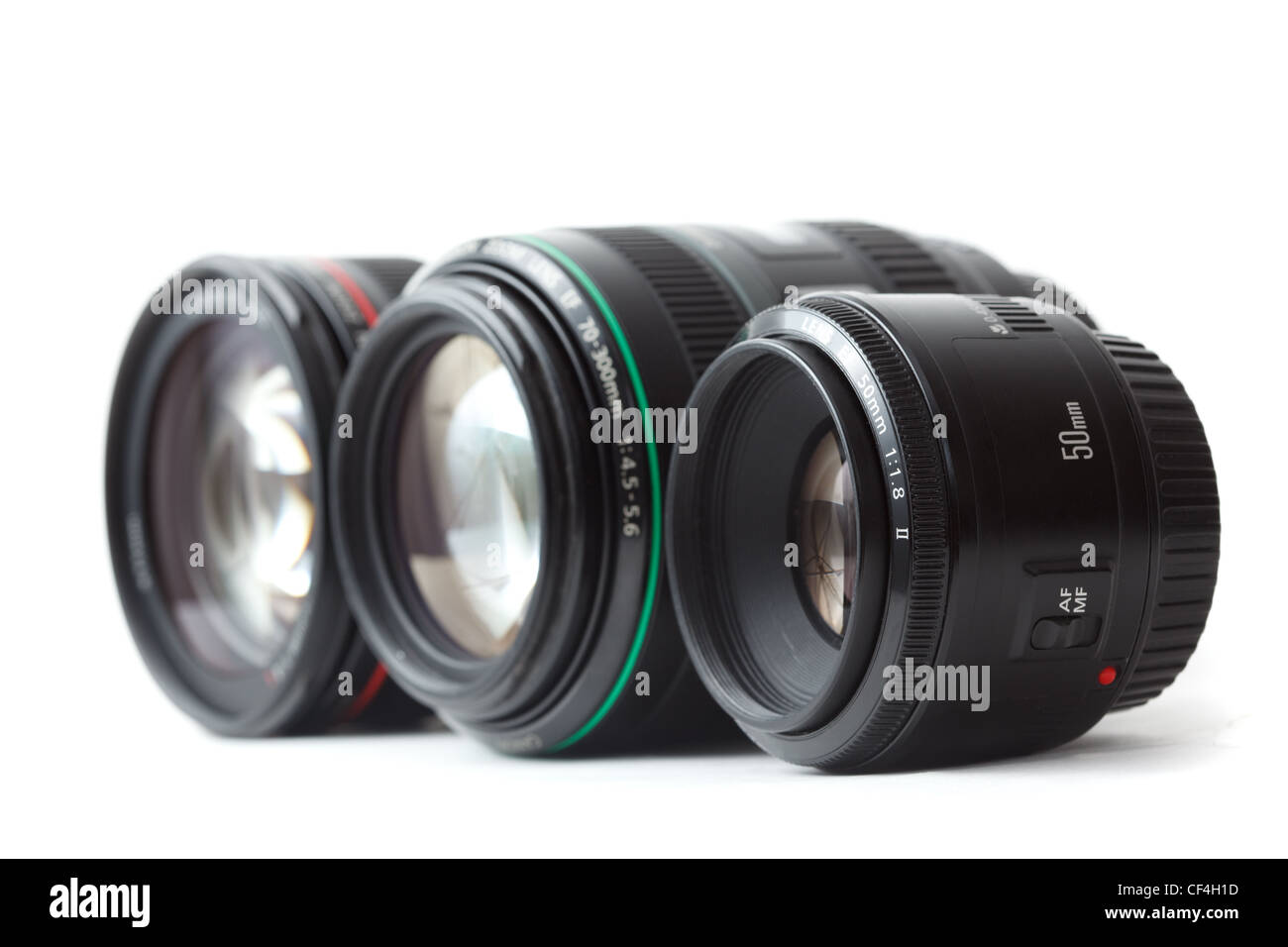 Three of lens to camera put in row. Isolated on white background. Focus ...